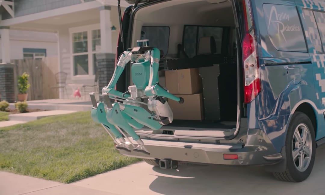 Ford robot folds up in car after delivering packages at door ...