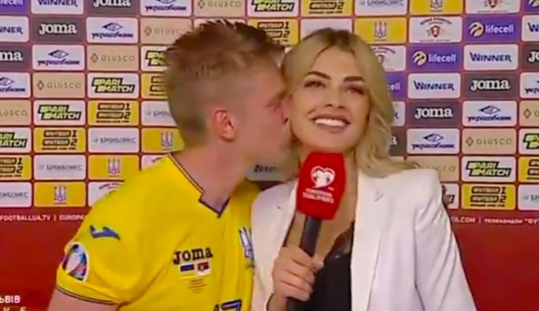 Ukrainian footballer kisses female reporter on live TV after victory